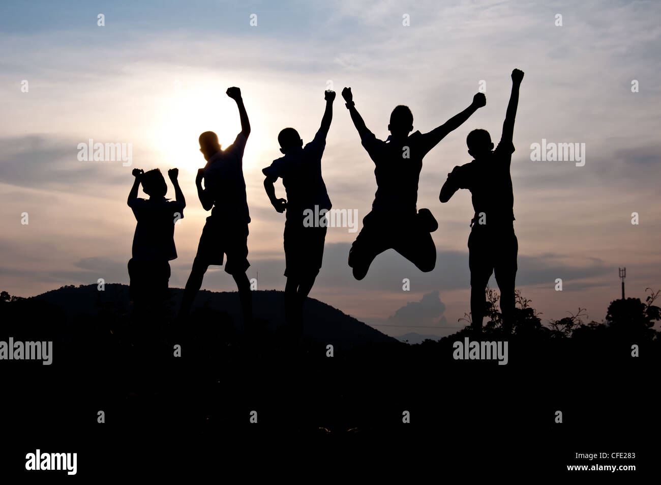 silhouette of boy victory and success together Stock Photo - Alamy