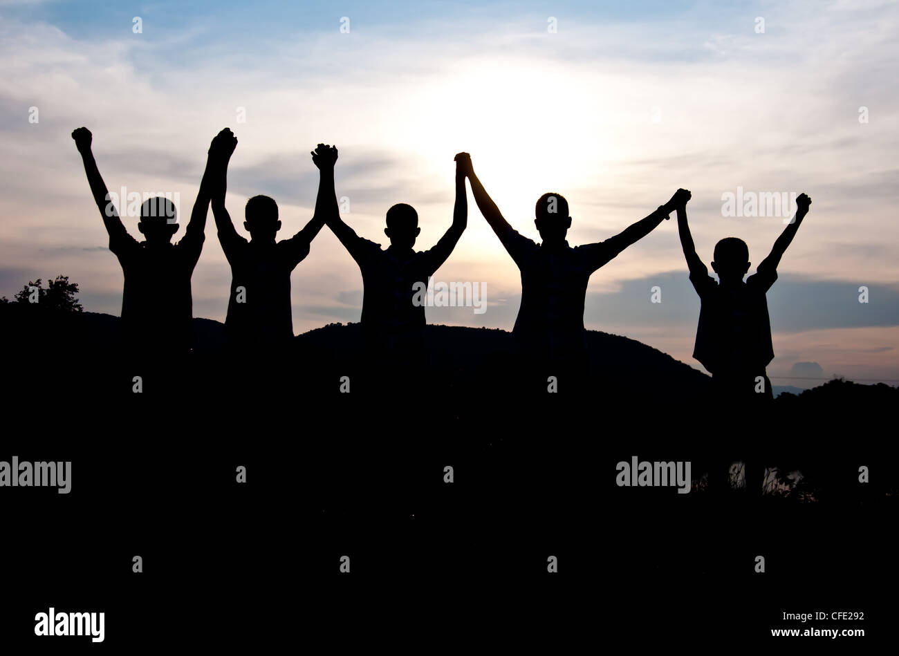 silhouette of boy victory and success together Stock Photo - Alamy