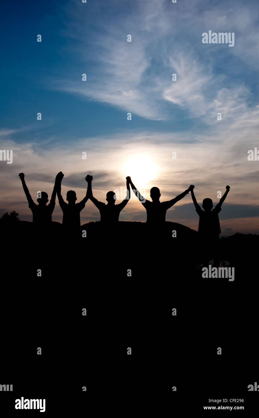 Silhouette boy victory success together hi-res stock photography and ...