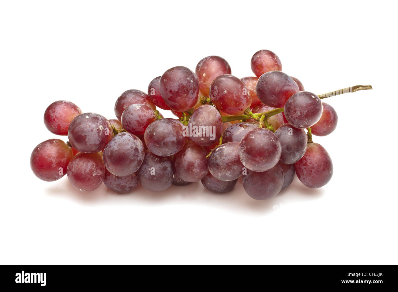 Bunch of red grapes on white background Stock Photo - Alamy