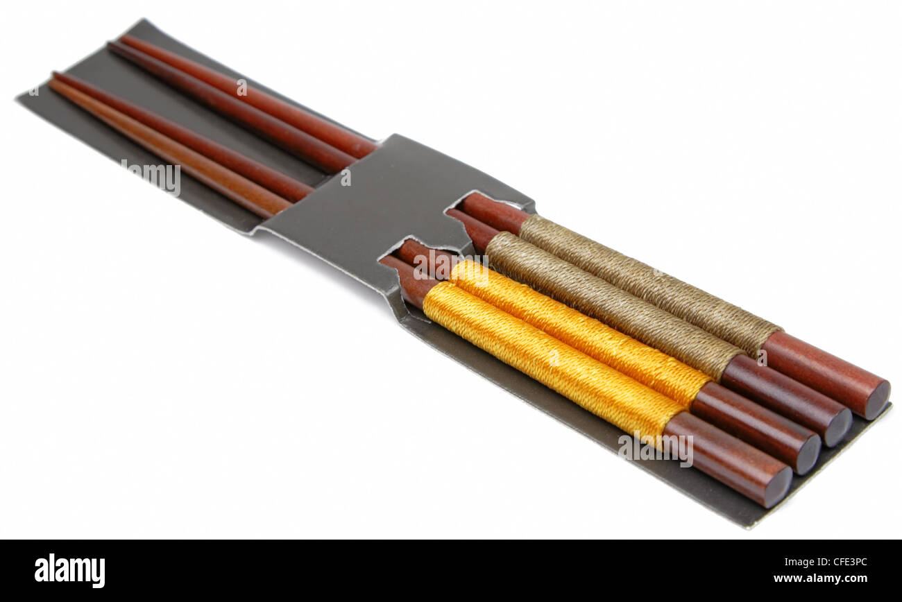 Chopsticks in a paper support isolated over white background Stock ...