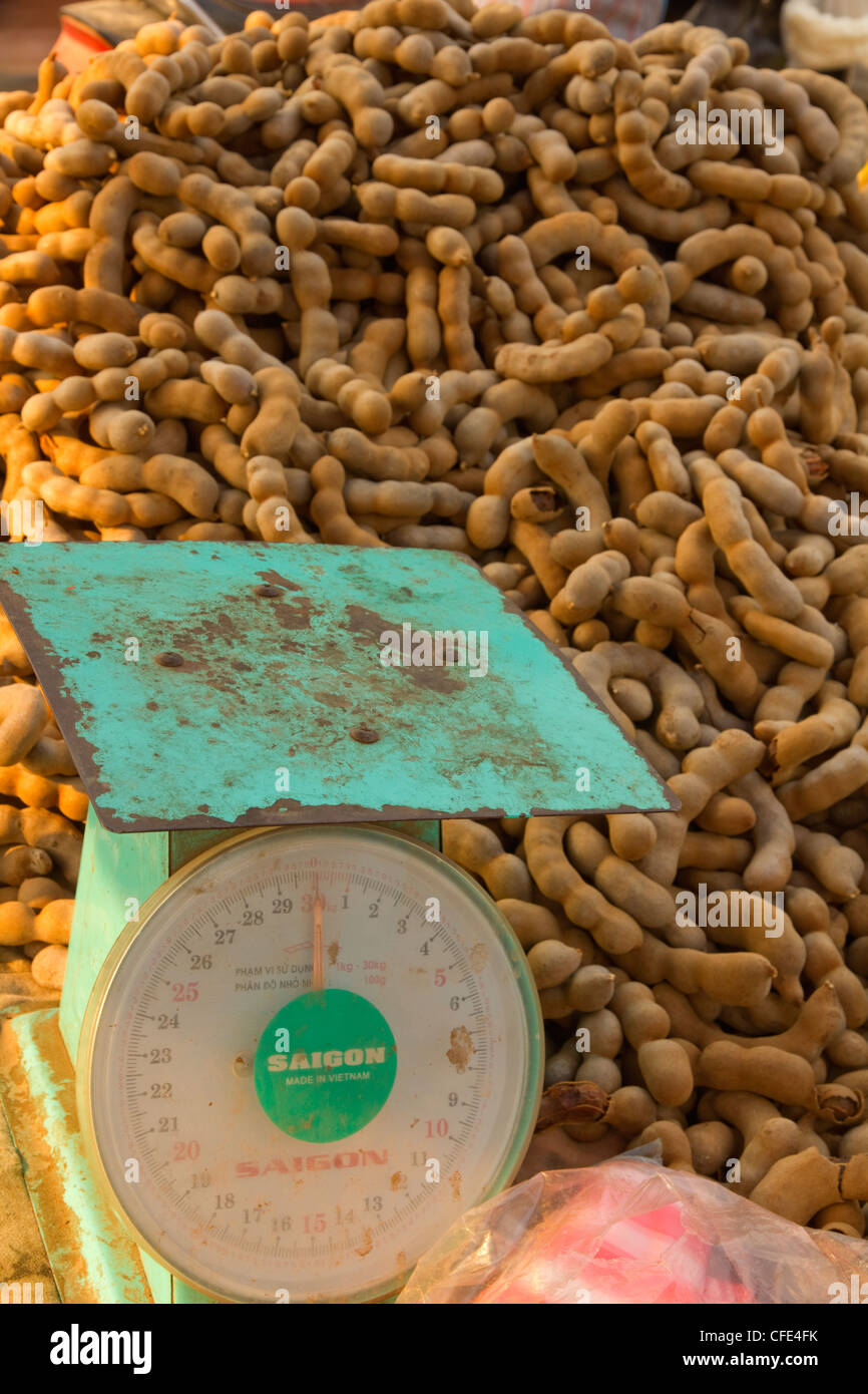 Tamarind Pods for sale with weighing scales Stock Photo - Alamy