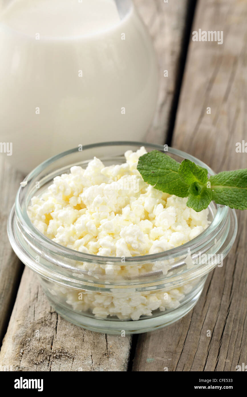 natural dairy product cottage cheese on a wooden table, rustic style ...