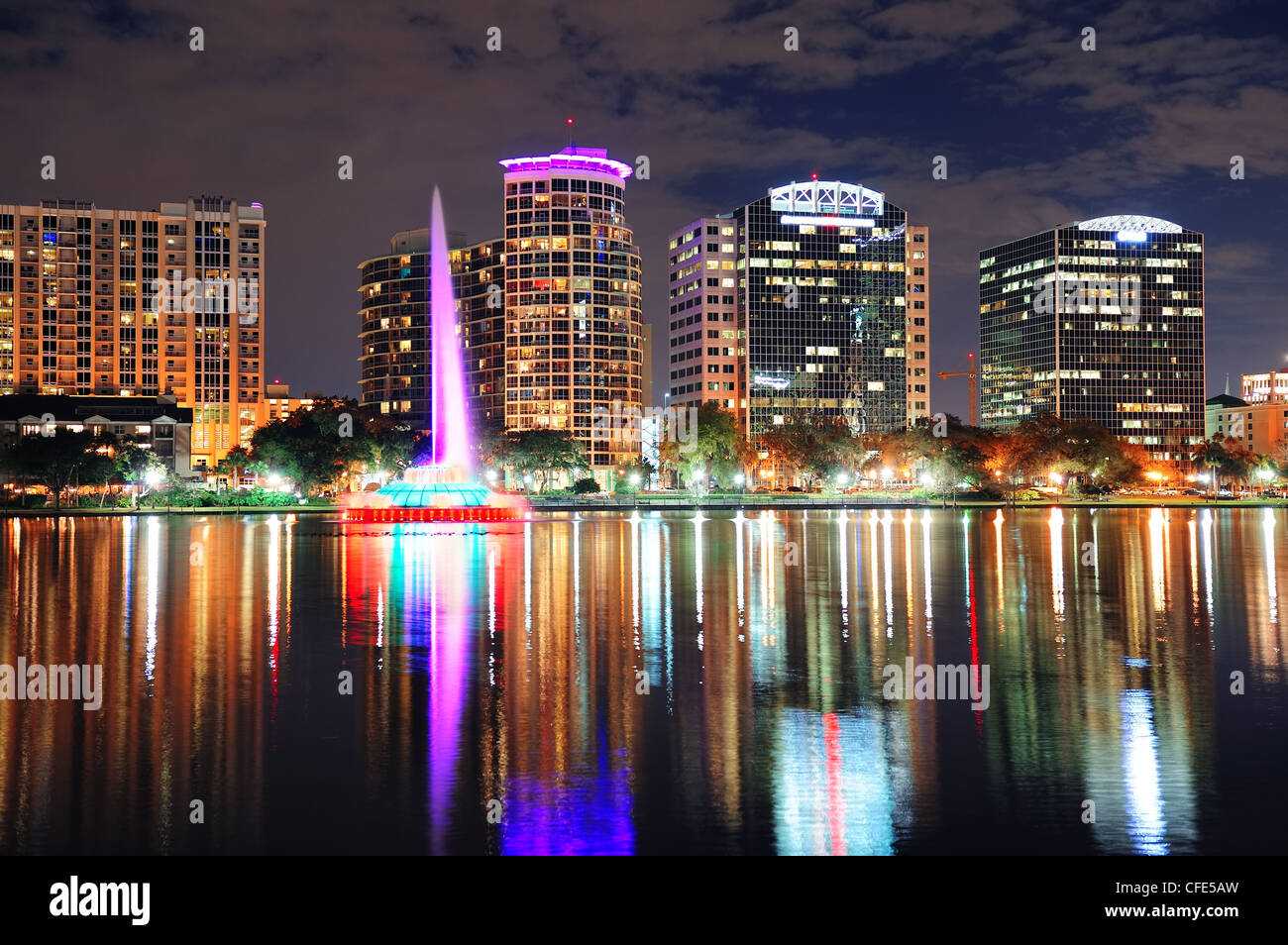 Orlando downtown skyline over Lake Eola at dusk with urban skyscrapers ...