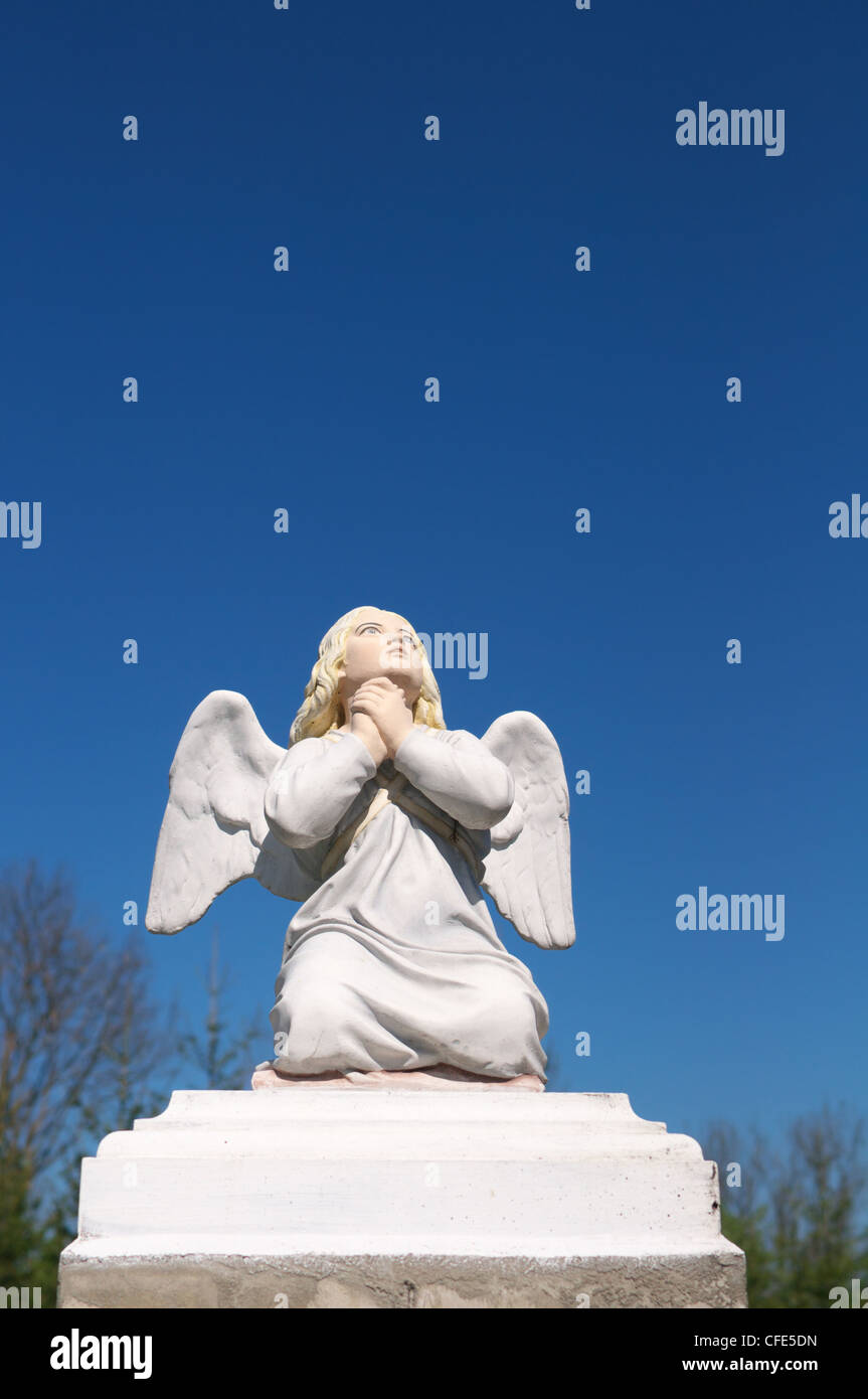 Praying angel Stock Photo - Alamy