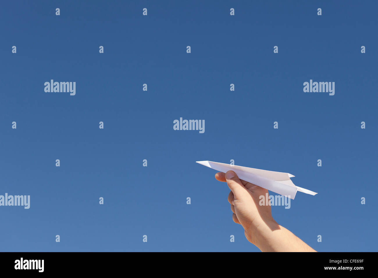 Hand throwing paper plane hi-res stock photography and images - Alamy