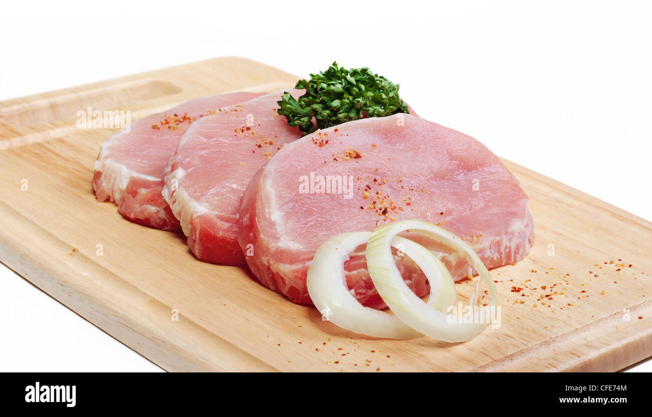 Fresh slices of pork isolated on white Stock Photo - Alamy