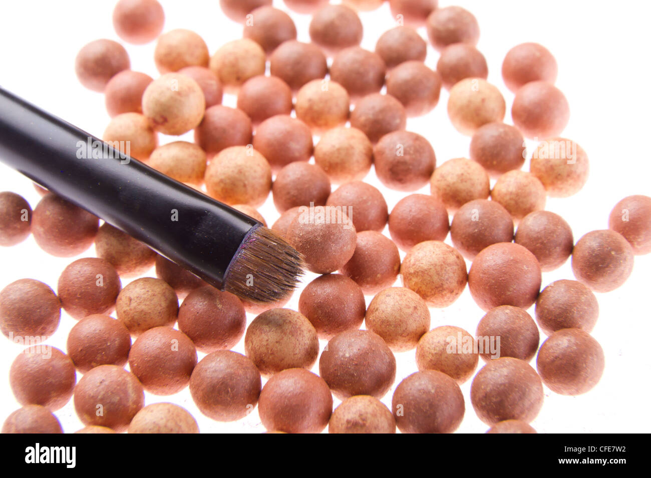 bronzing pearls isolated on white background Stock Photo - Alamy