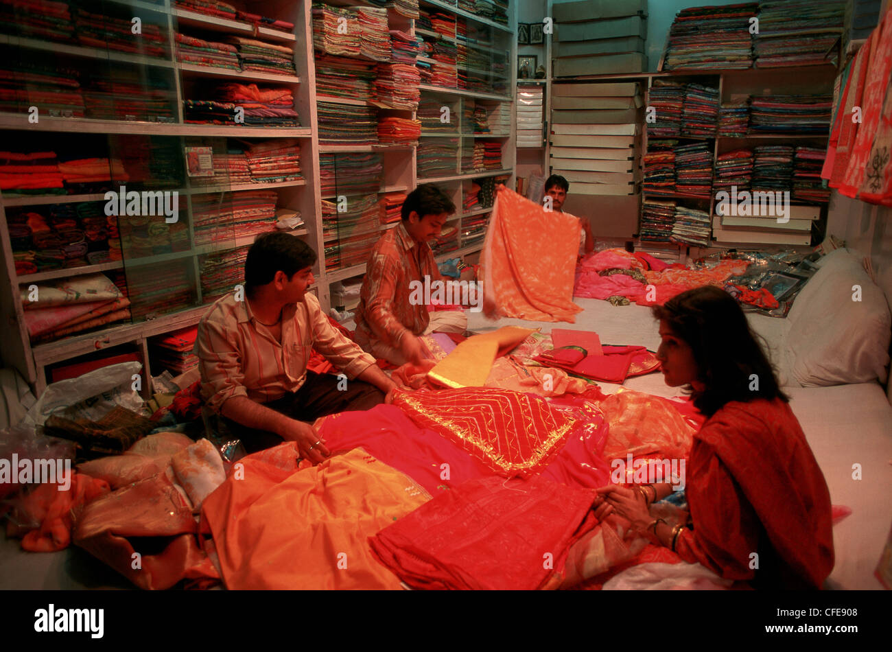 A young woman is choosing cloth for a sari in a shop ( India Stock ...