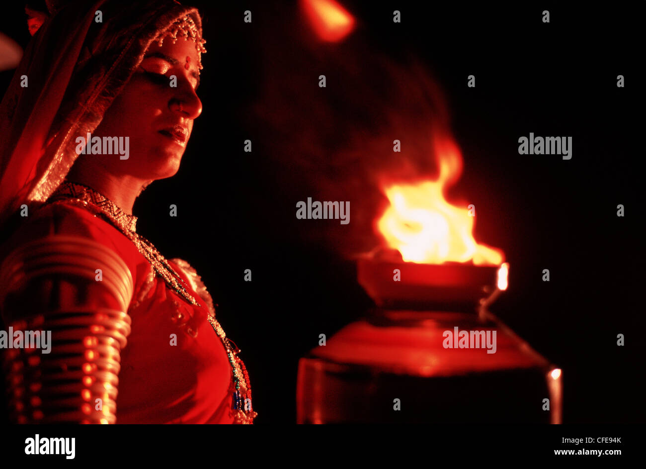 Dancer performing the fire dance ( India Stock Photo - Alamy