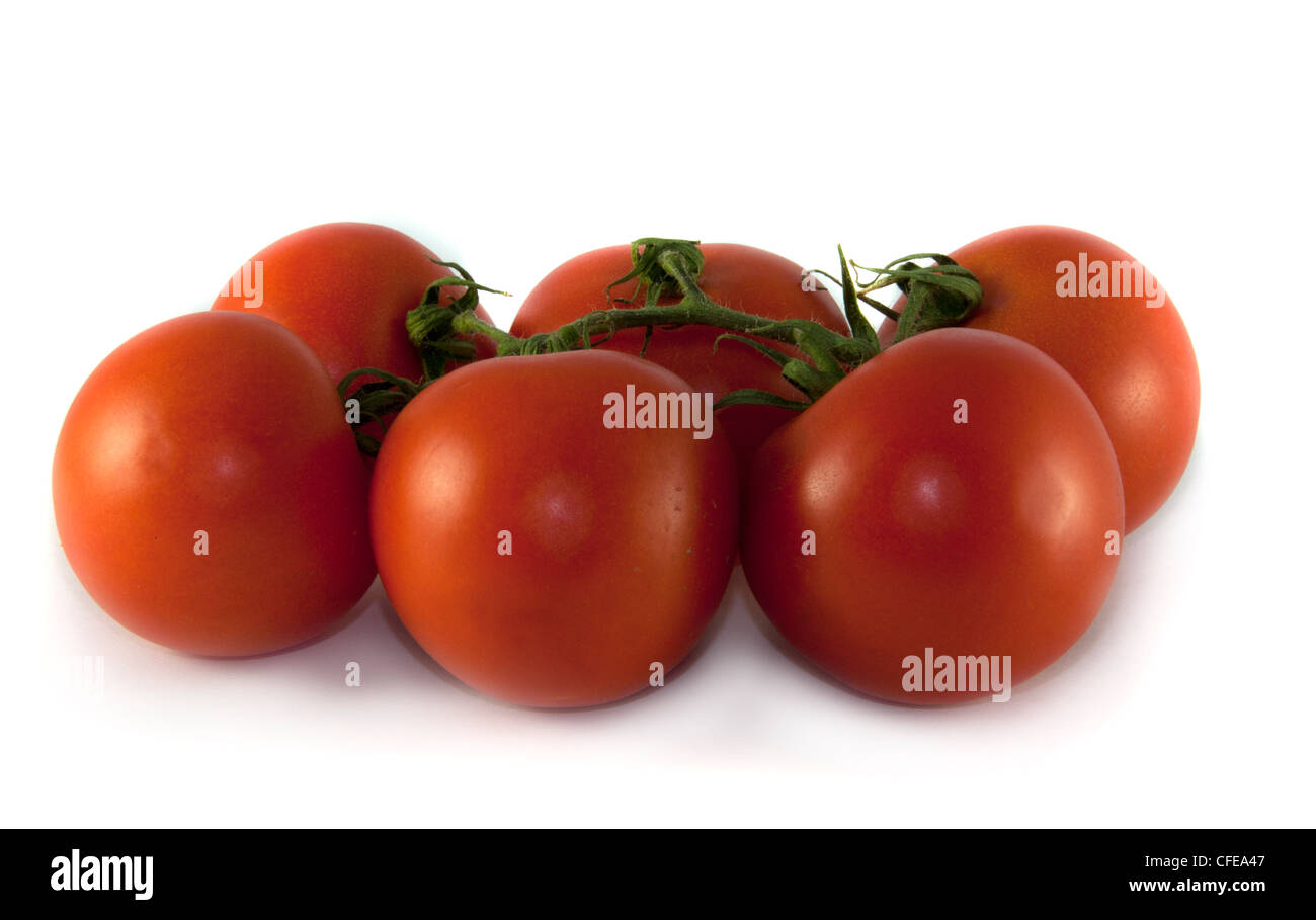 six fresh red tomatoes isolated on white Stock Photo - Alamy