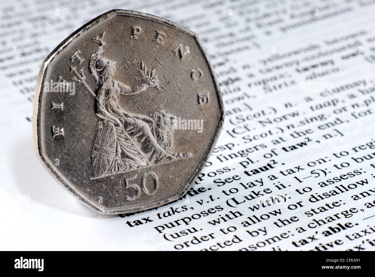 Generic image of 50 pence piece on a dictionary entry for the word Tax ...