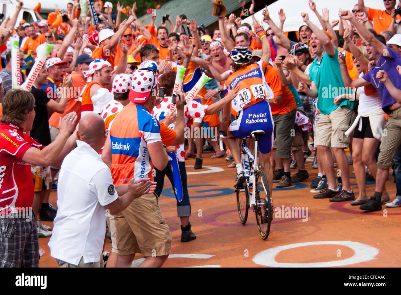 Laurens Ten Dam, riding in the 2011 Tour de France, is saluted by his ...