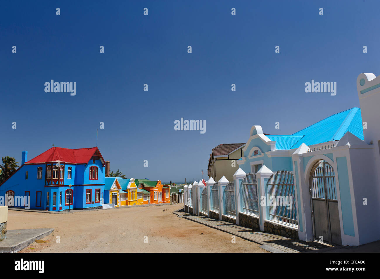 Bright coloured colonial houses in Berg Strasse. Luderitz, Namibia ...