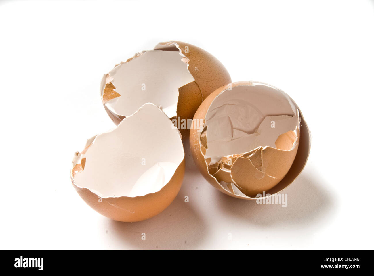 Three broken, empty brown eggshells Stock Photo - Alamy