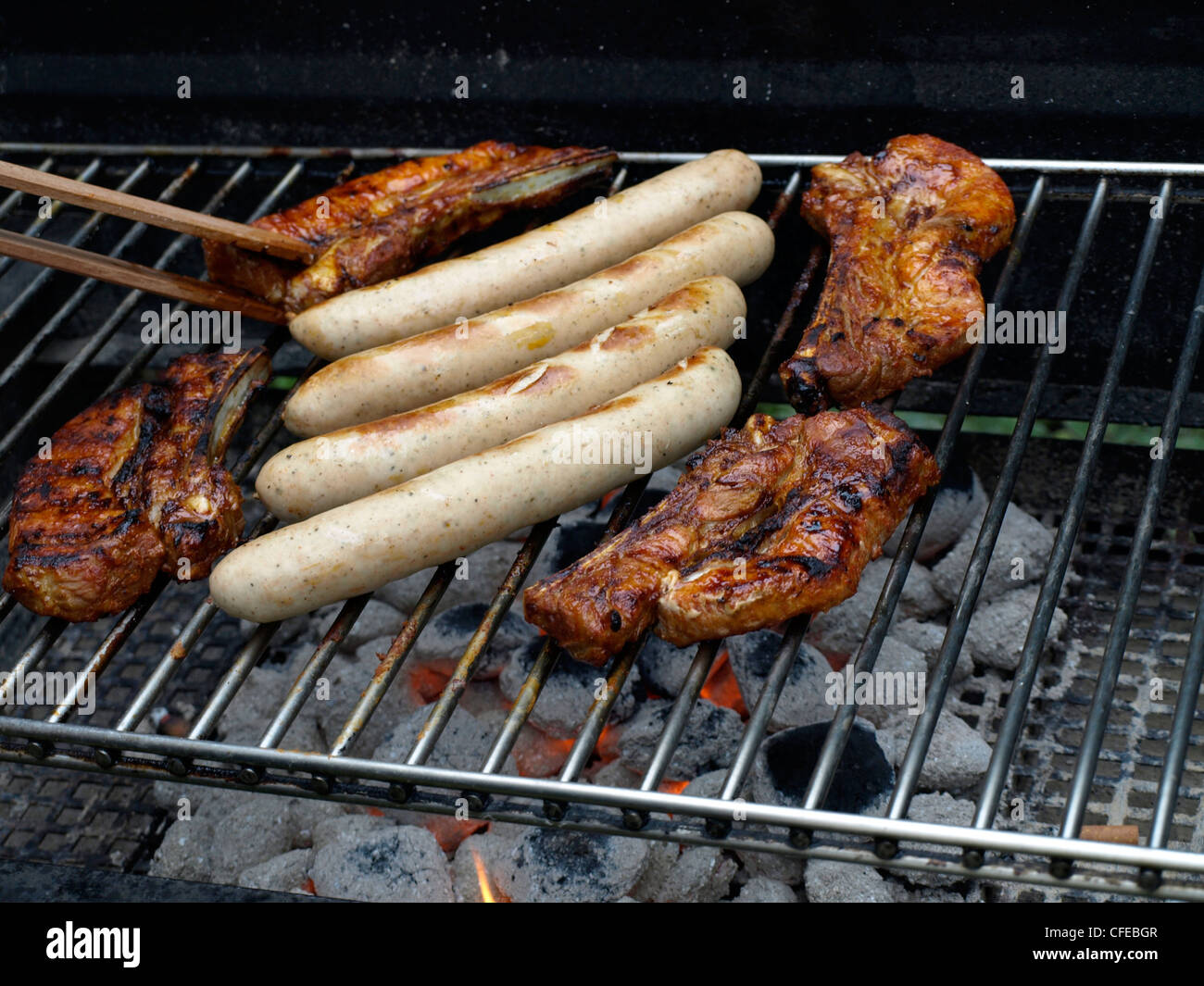 Grilled rips and sausages Stock Photo - Alamy