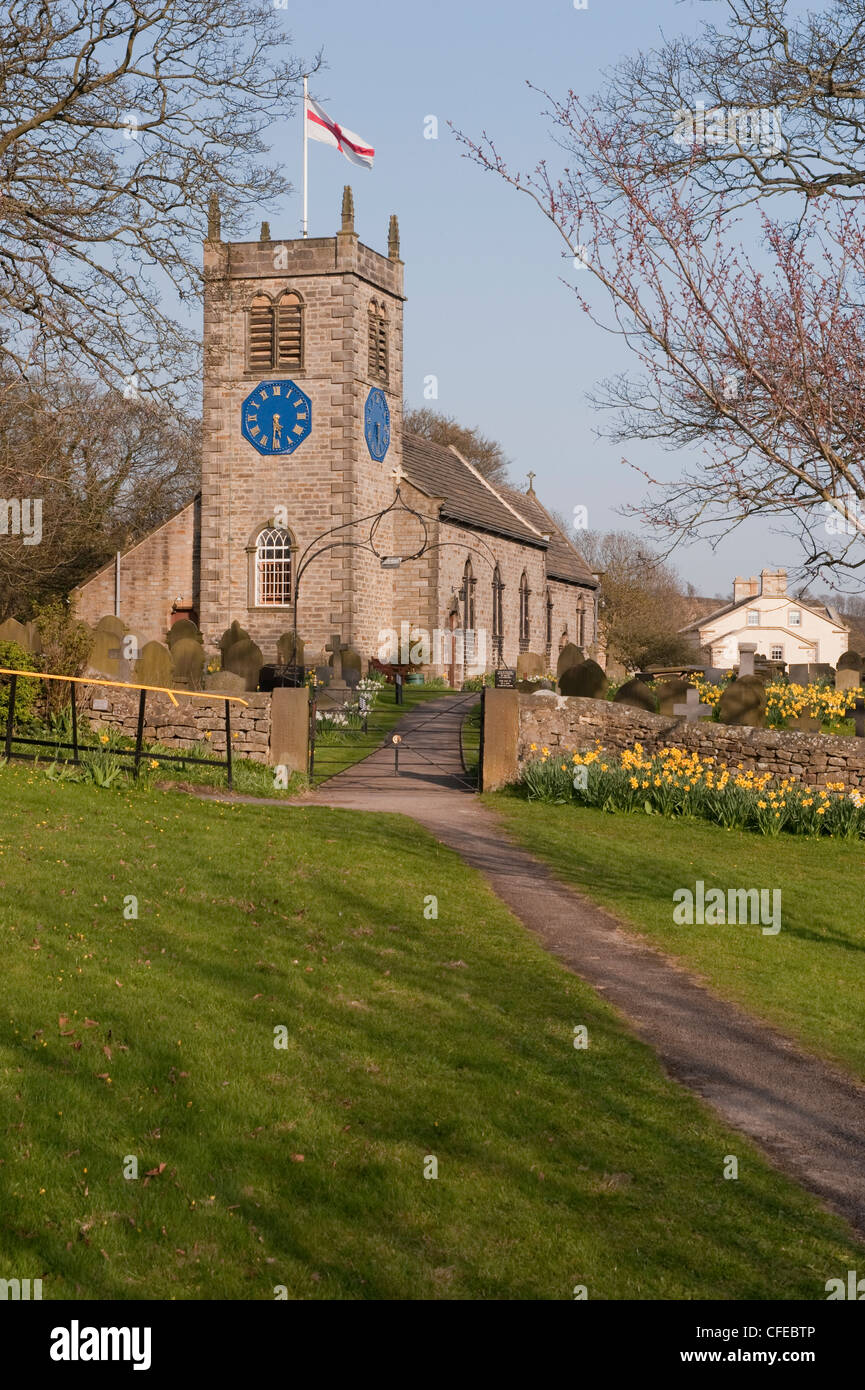 Gateway entrance arch, daffodils in churchyard & historic, picturesque ...