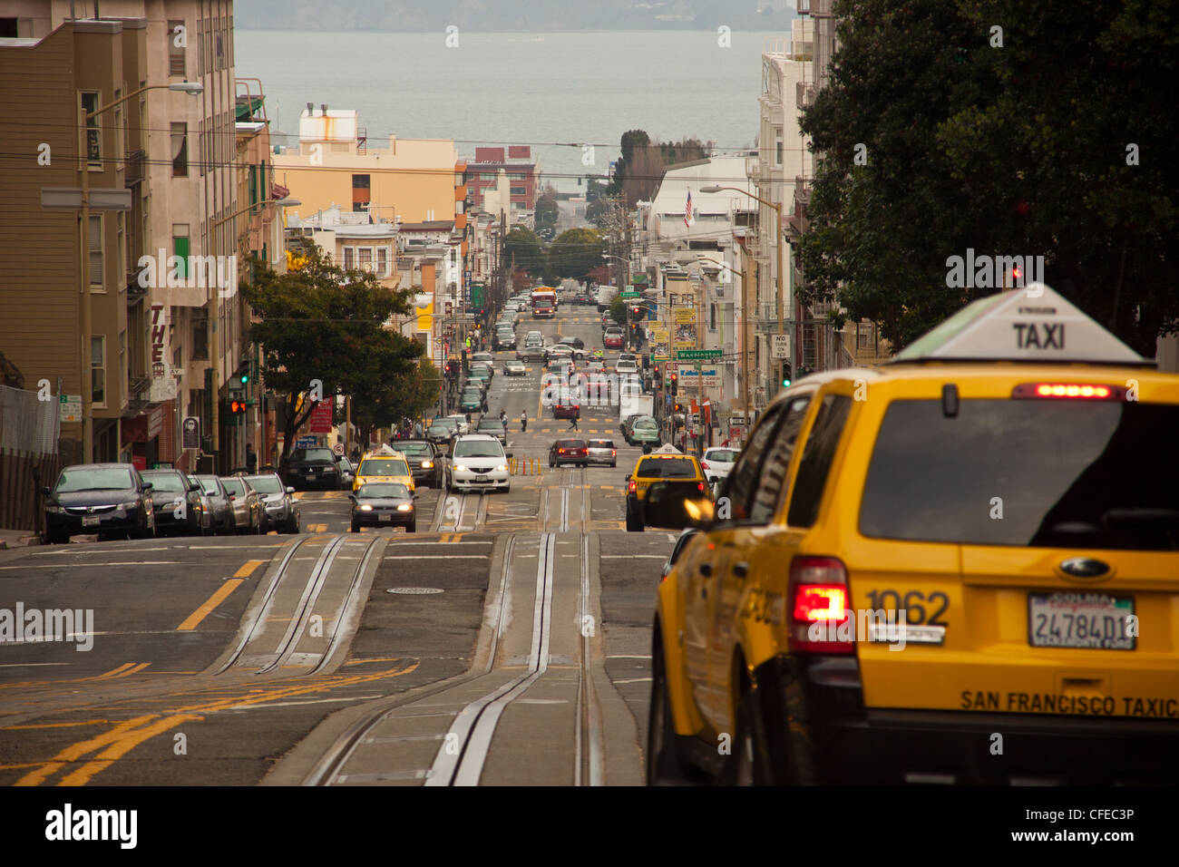 san francisco street scene,showing cable car tracks with cars and taxis ...