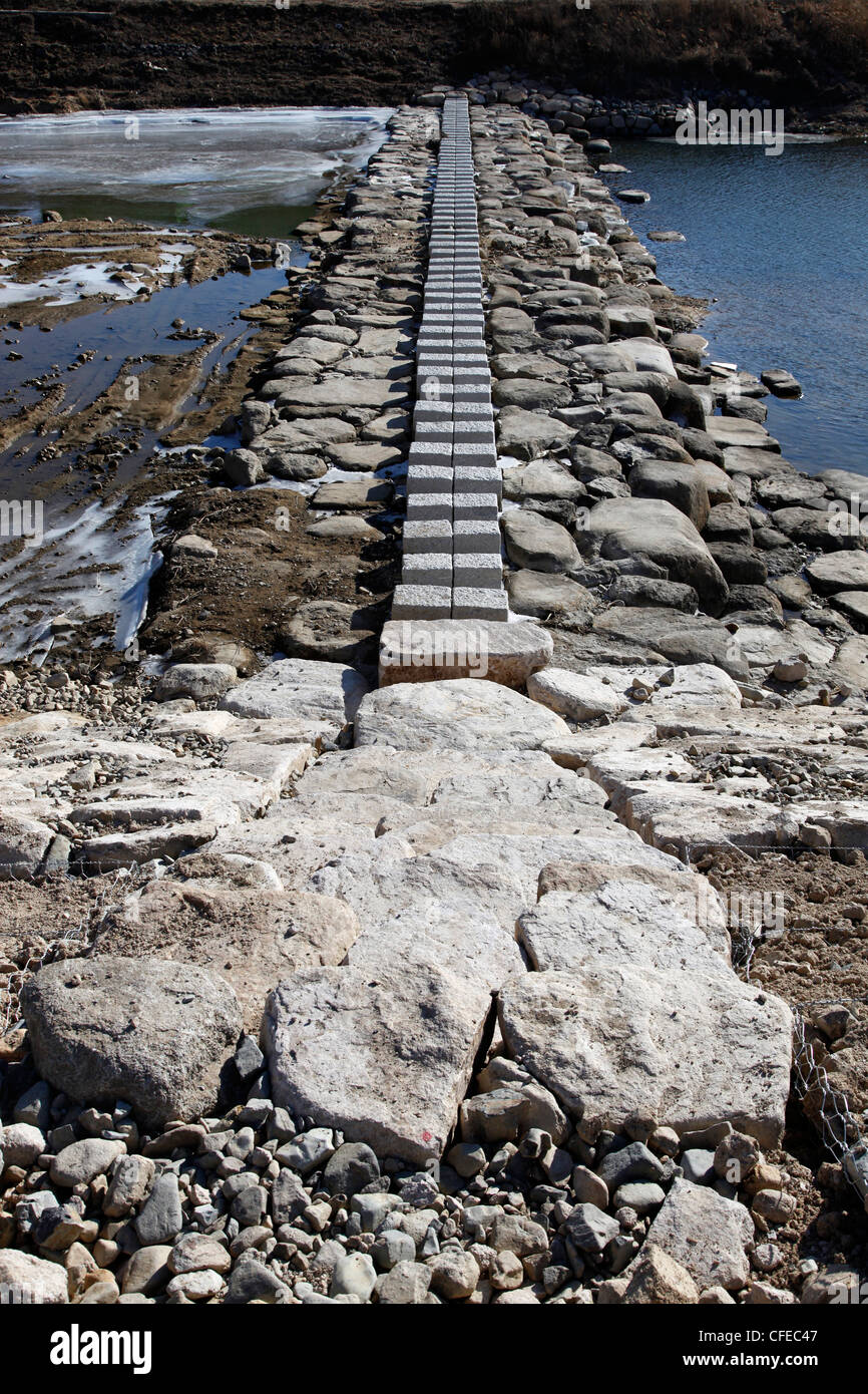 Stepping stones across a river dam in Gyeongju, South Korea Stock Photo ...
