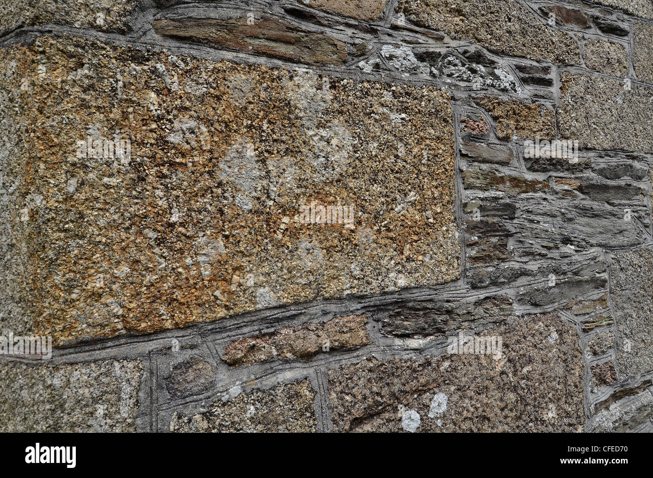 Granite and stone building wall Stock Photo - Alamy