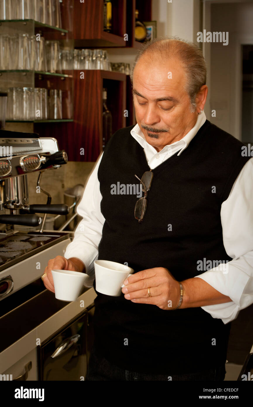 Italian man barista preparing espresso in cafe Stock Photo - Alamy