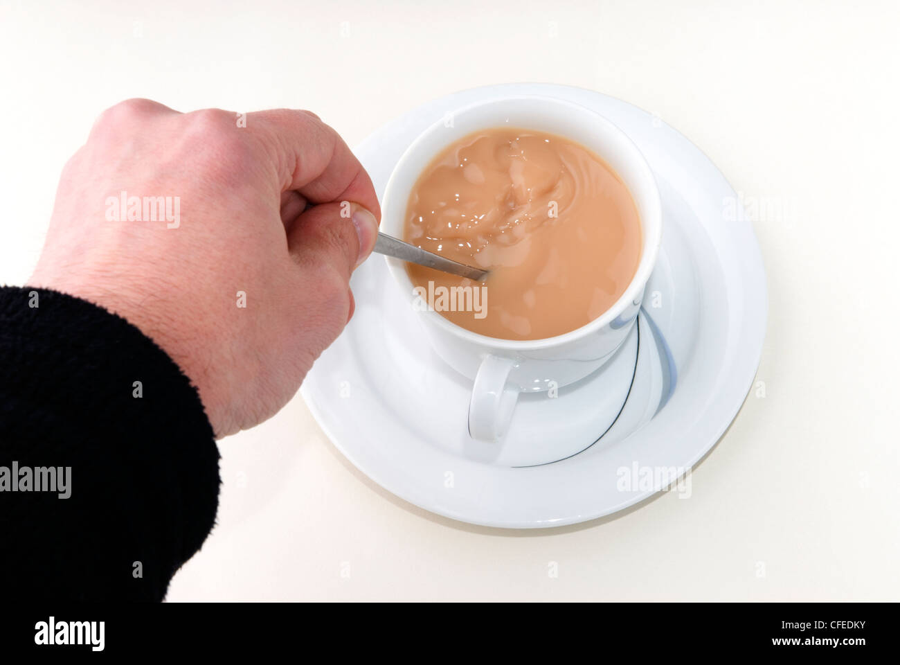 Time for tea. A quick stir and then the nice cup of tea is ready and ...