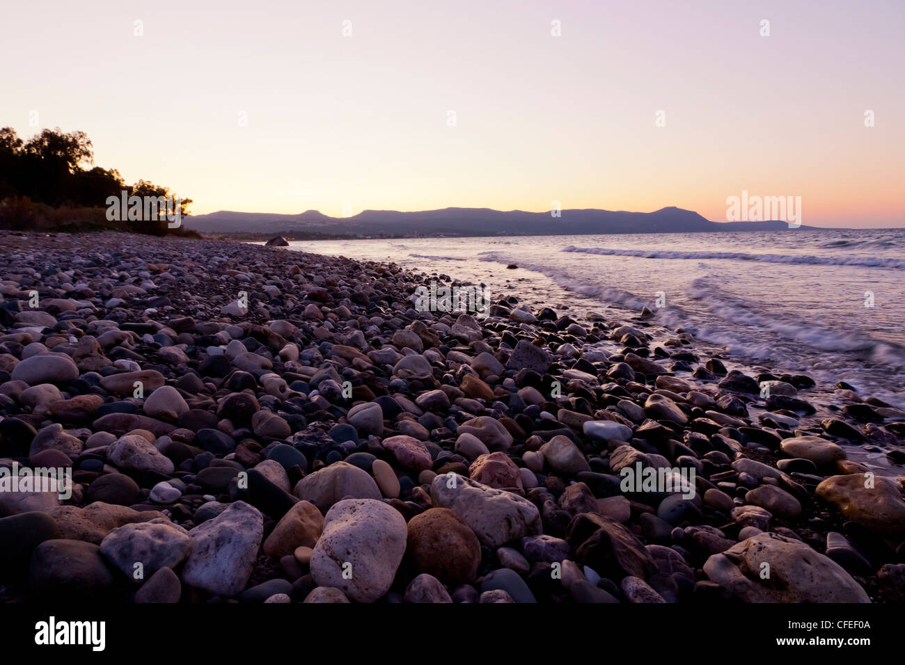 Purple sunset at Polis campsite beach Stock Photo - Alamy