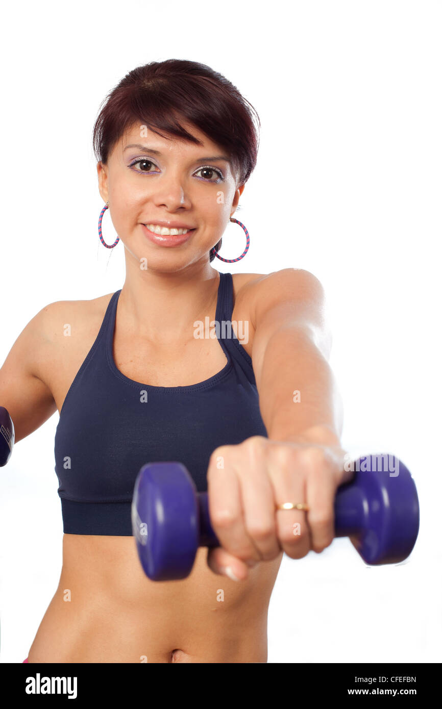 Female fitness instructor with slender and toned physique smiles while ...