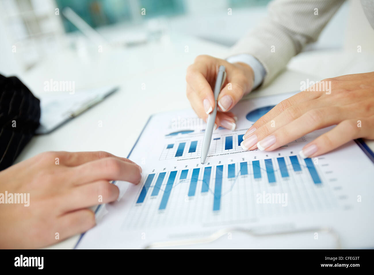 Image of female hands with pens over business document at meeting Stock ...