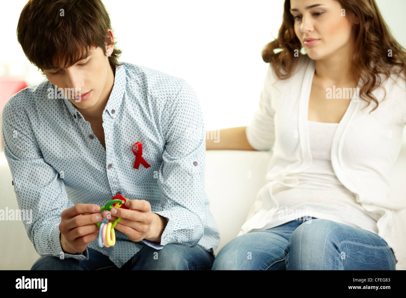 Young couple discussing family matters and the possibility of having a ...