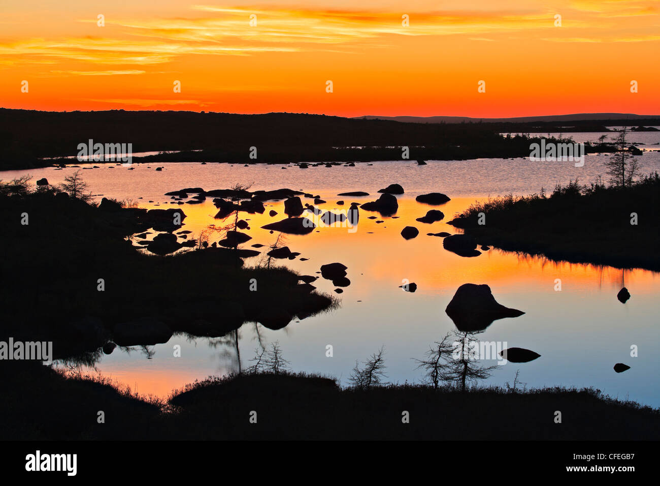 Sunset over a pond along Highway 510, the Labrador Coastal Drive,Red ...