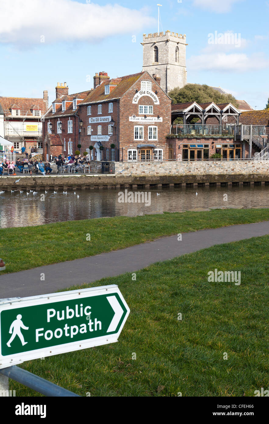 Footpath in front of Wareham Quay on a sunny market day. The Granary in ...