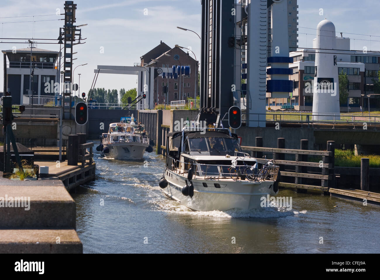 Ships passing lifting-bridges and locked in through lock-gate ...