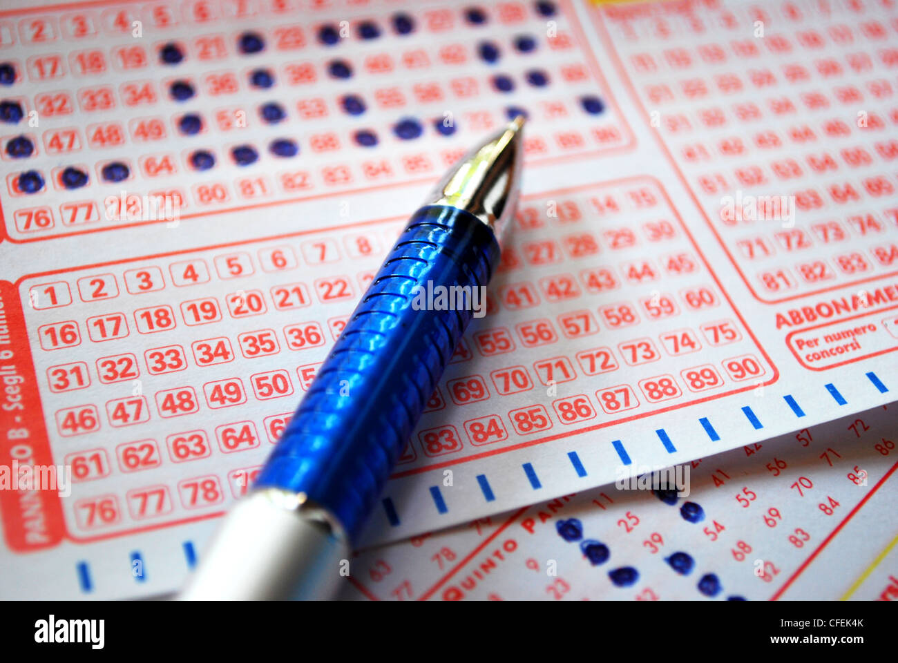Closeup detail of a lottery ticket and a pen writing lucky word Stock ...