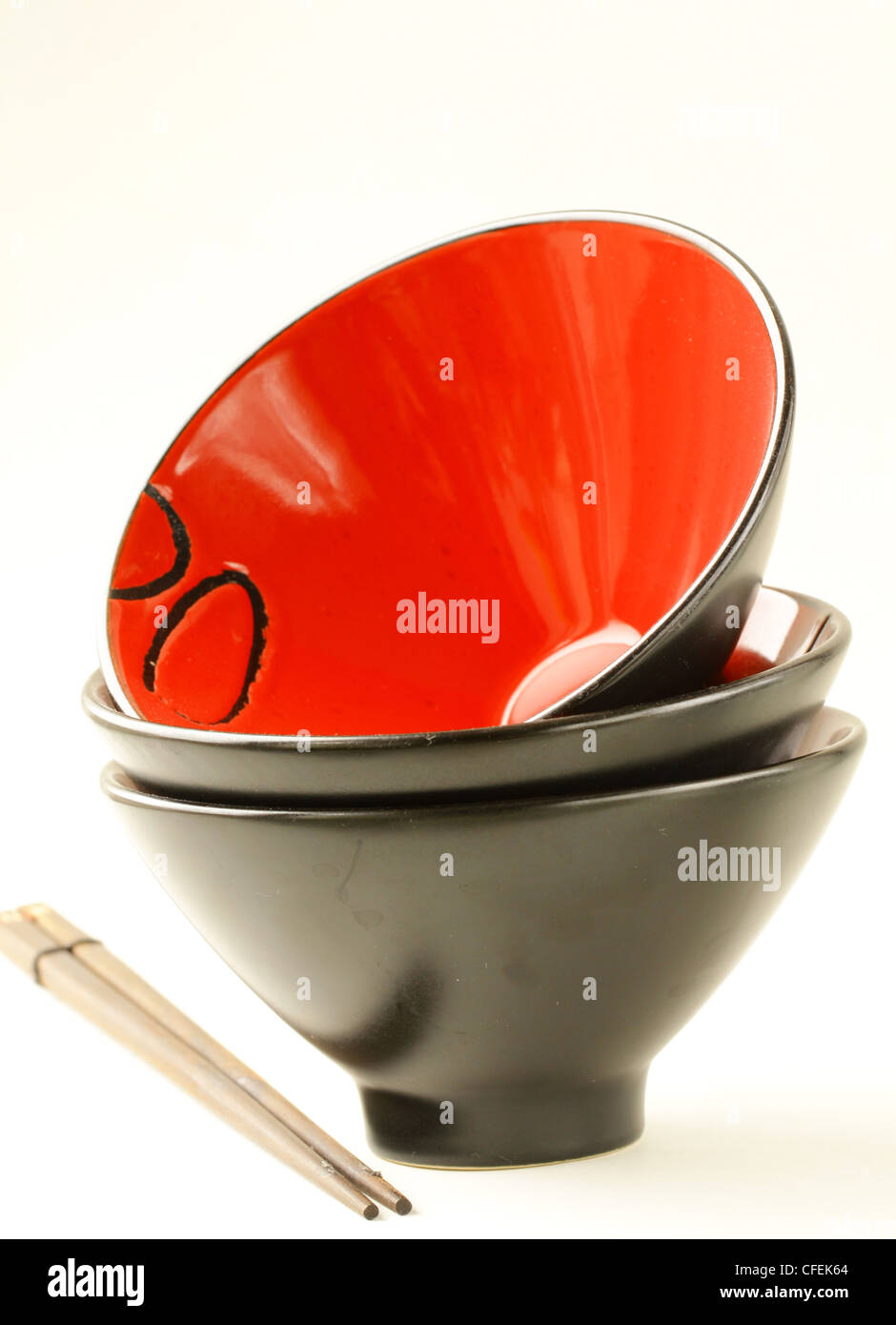 Asian cups and chopsticks on white background Stock Photo - Alamy