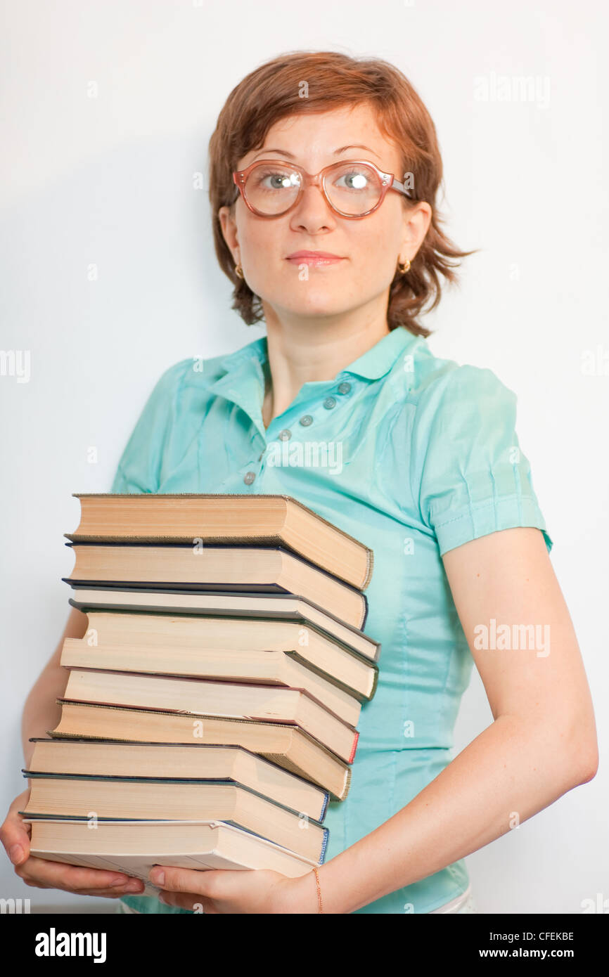 Cute young Girl holding books Stock Photo - Alamy