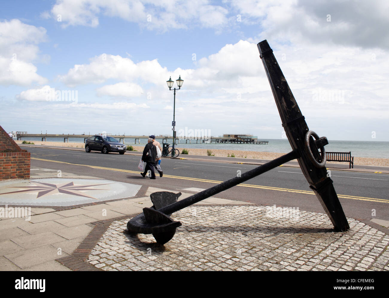 An anchor sculpture on the seafront at Deal, in Kent. The pier is ...