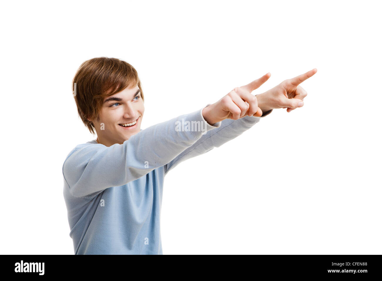 Portrait of a handsome young man pointing, isolated over a white ...