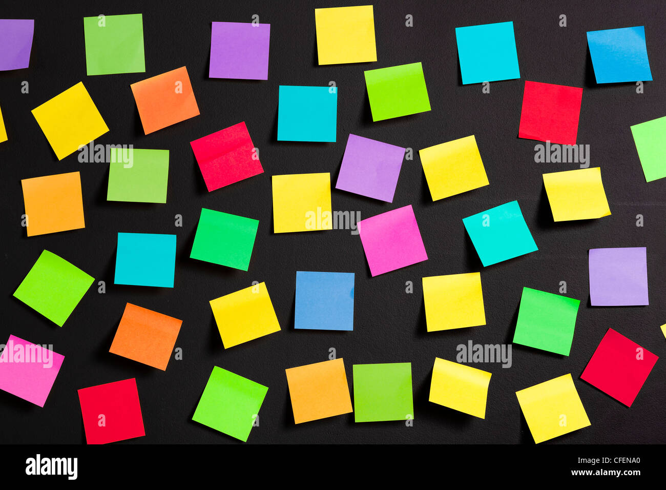 background image of multicolor notes on a black board Stock Photo - Alamy