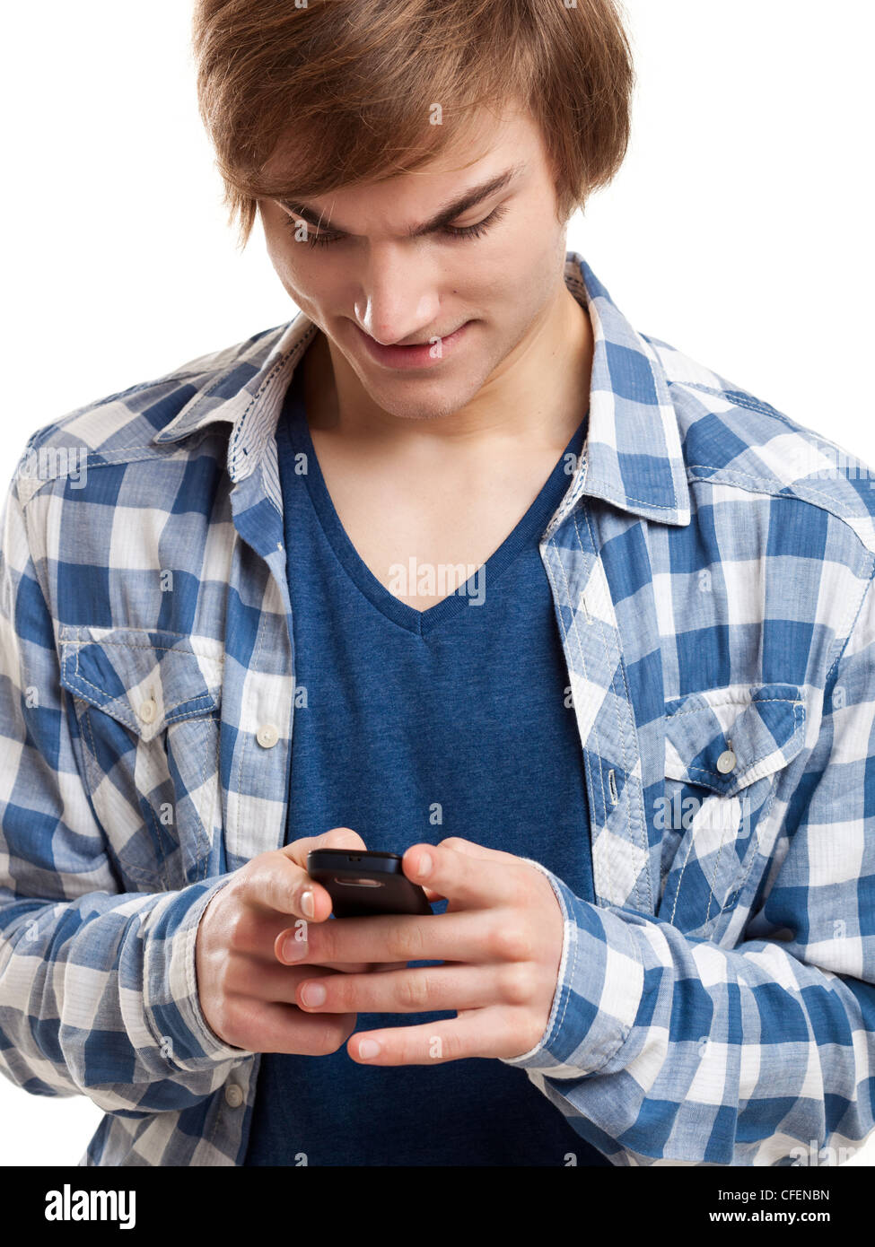 Portrait of handsome young man sending text messages with is mobile ...