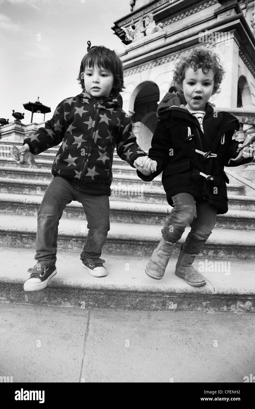Two people walking down steps Black and White Stock Photos & Images - Alamy