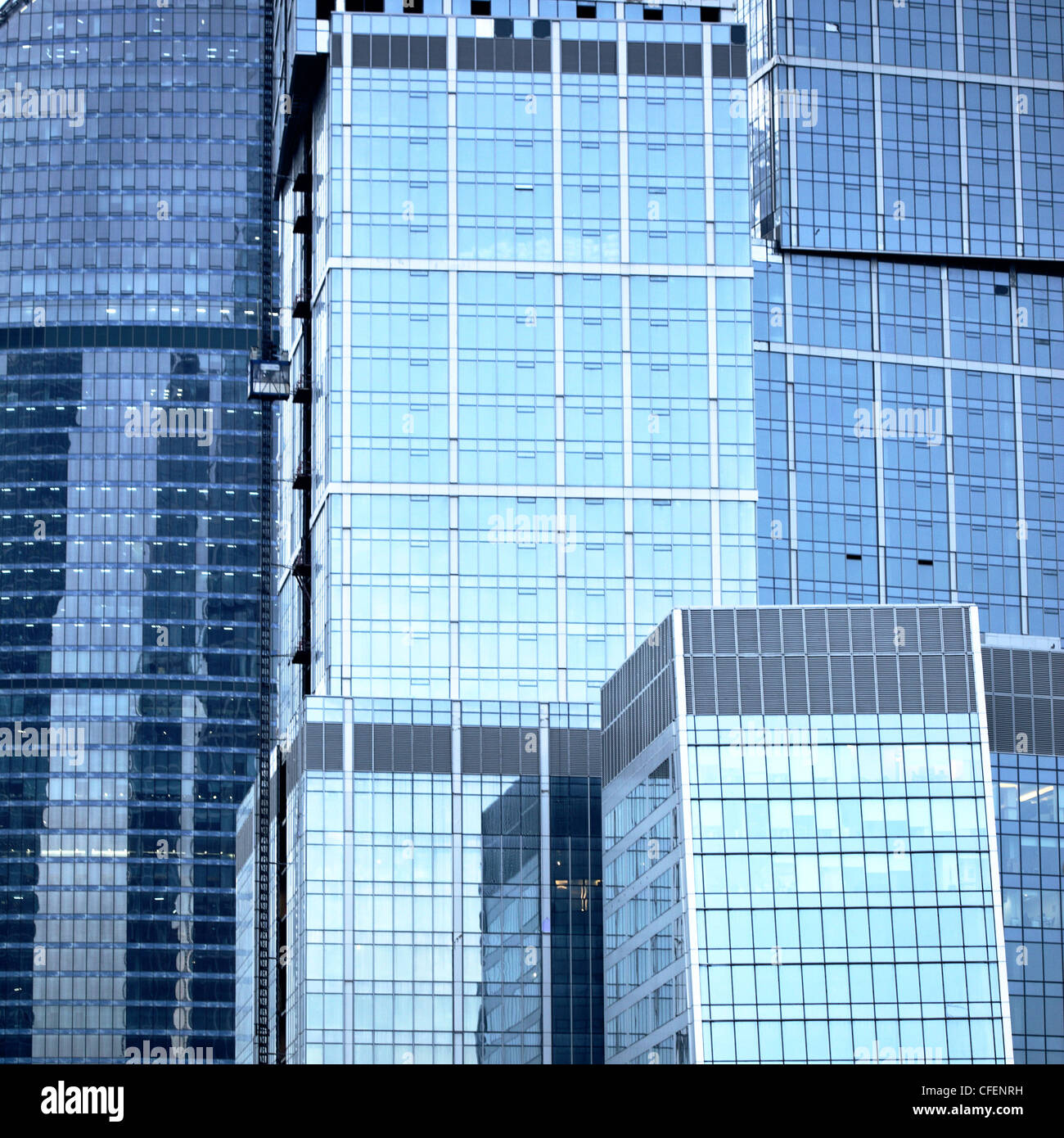 Modern skyscrapers close-up toned in blue color Stock Photo - Alamy