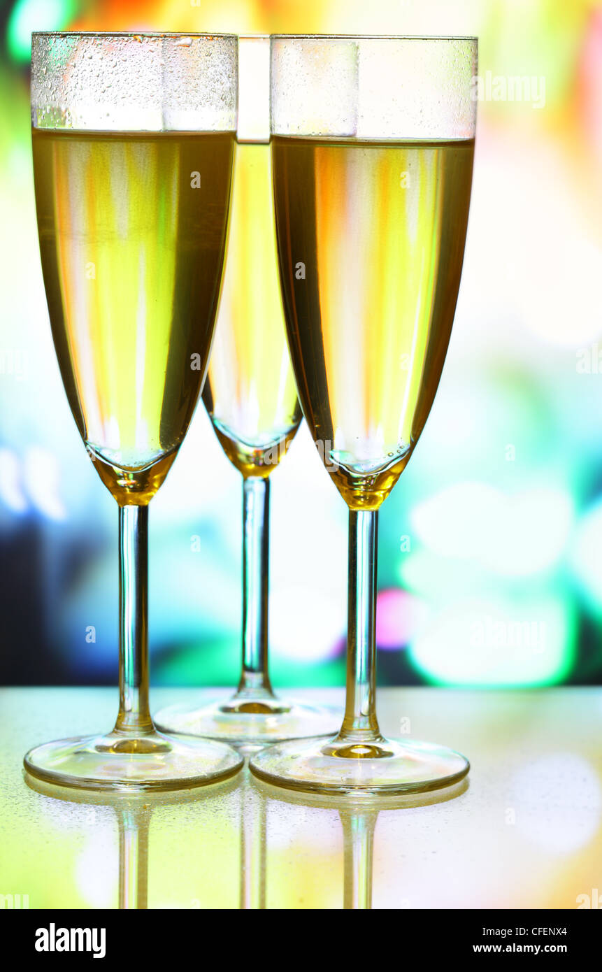 Champagne and holiday lights in the background Stock Photo - Alamy