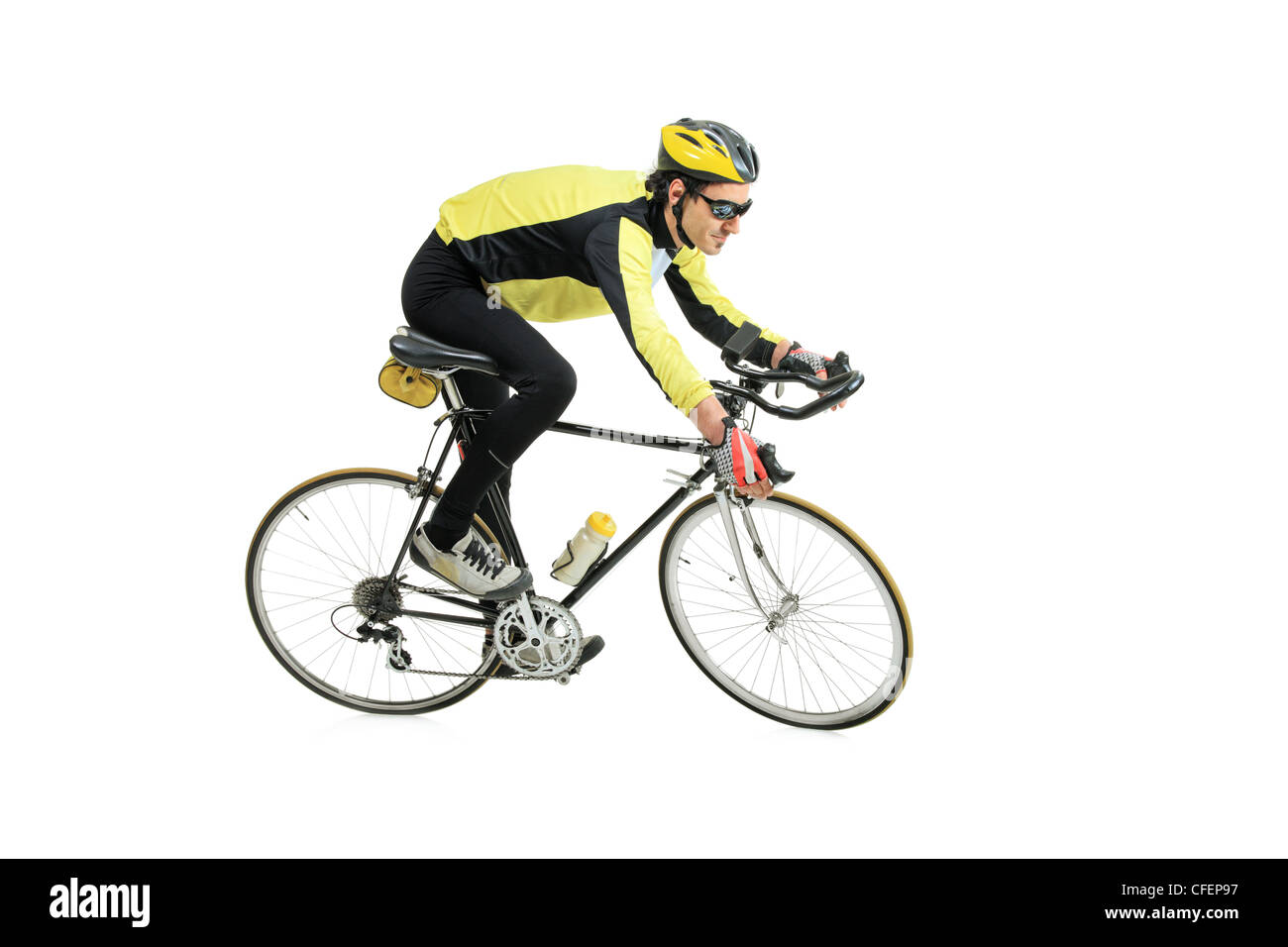 A young man riding a bicycle isolated against white background Stock ...