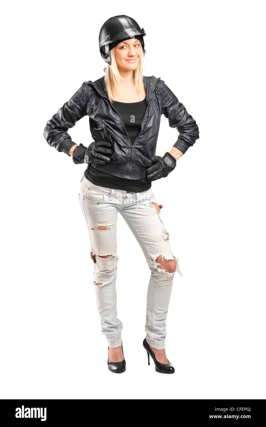 Full length portrait of a female biker with helmet isolated on white ...