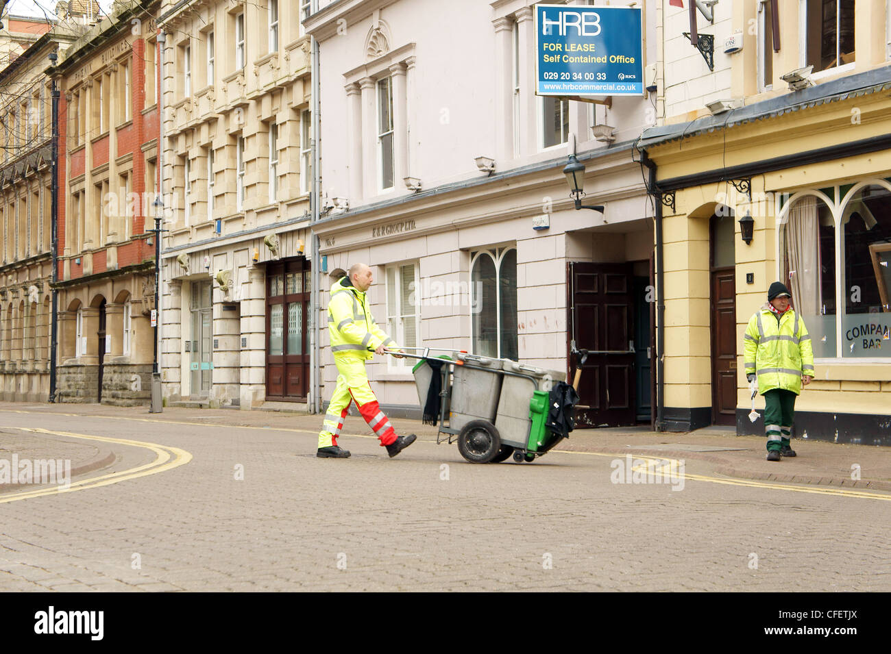 Street Cleaners collecting litter in Cardiff Bay, South Wales, UK Stock ...