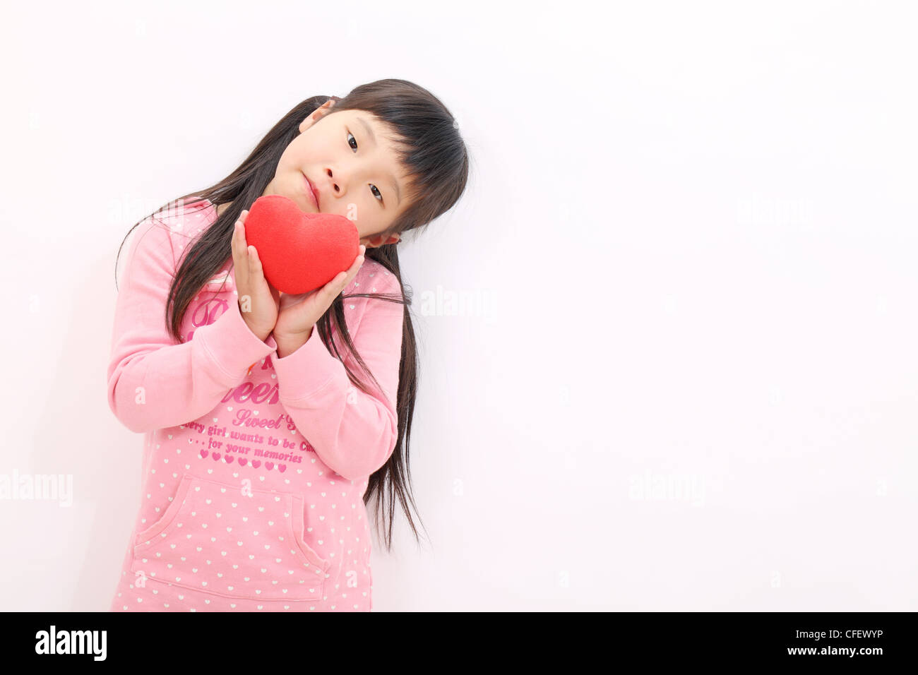 Portrait of little asian girl with heart Stock Photo - Alamy