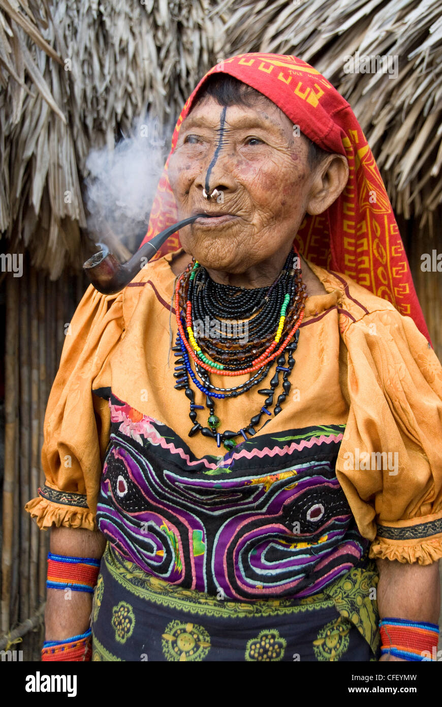 Kuna woman smoking a pipe, Playon Chico Village, San Blas Islands (Kuna ...