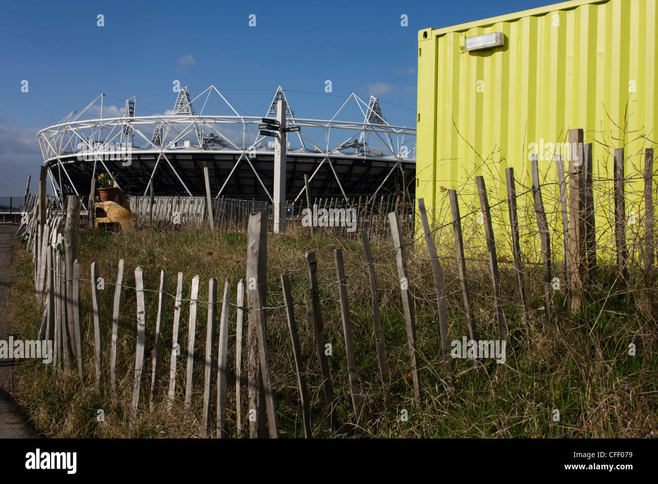 Incongruous landscape of bygone era fencing, shipping container and new ...