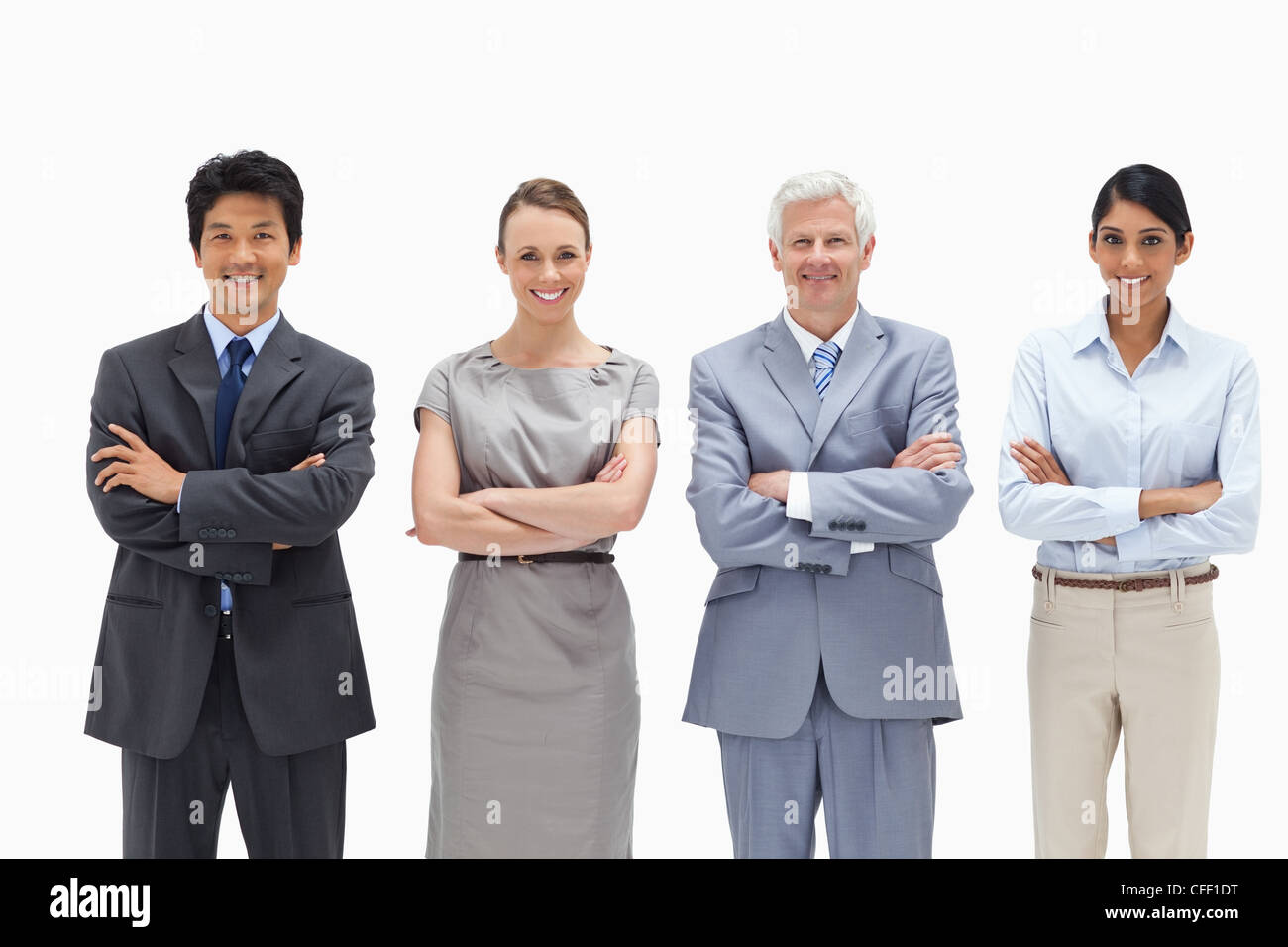 Multicultural business team smiling with their arms folded Stock Photo ...